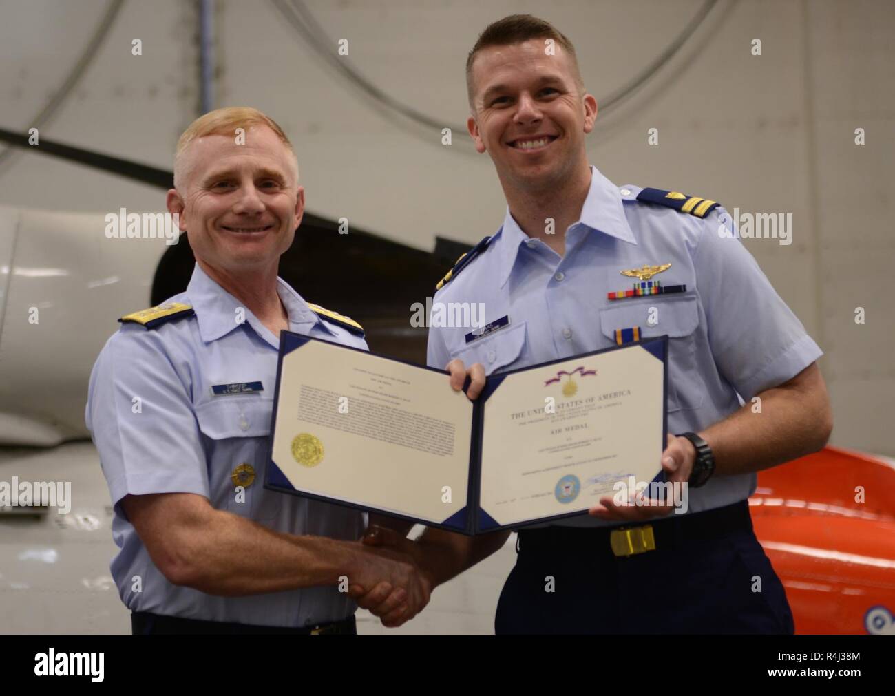 Rear Adm. David Throop, commander, Coast Guard 13th District presents ...