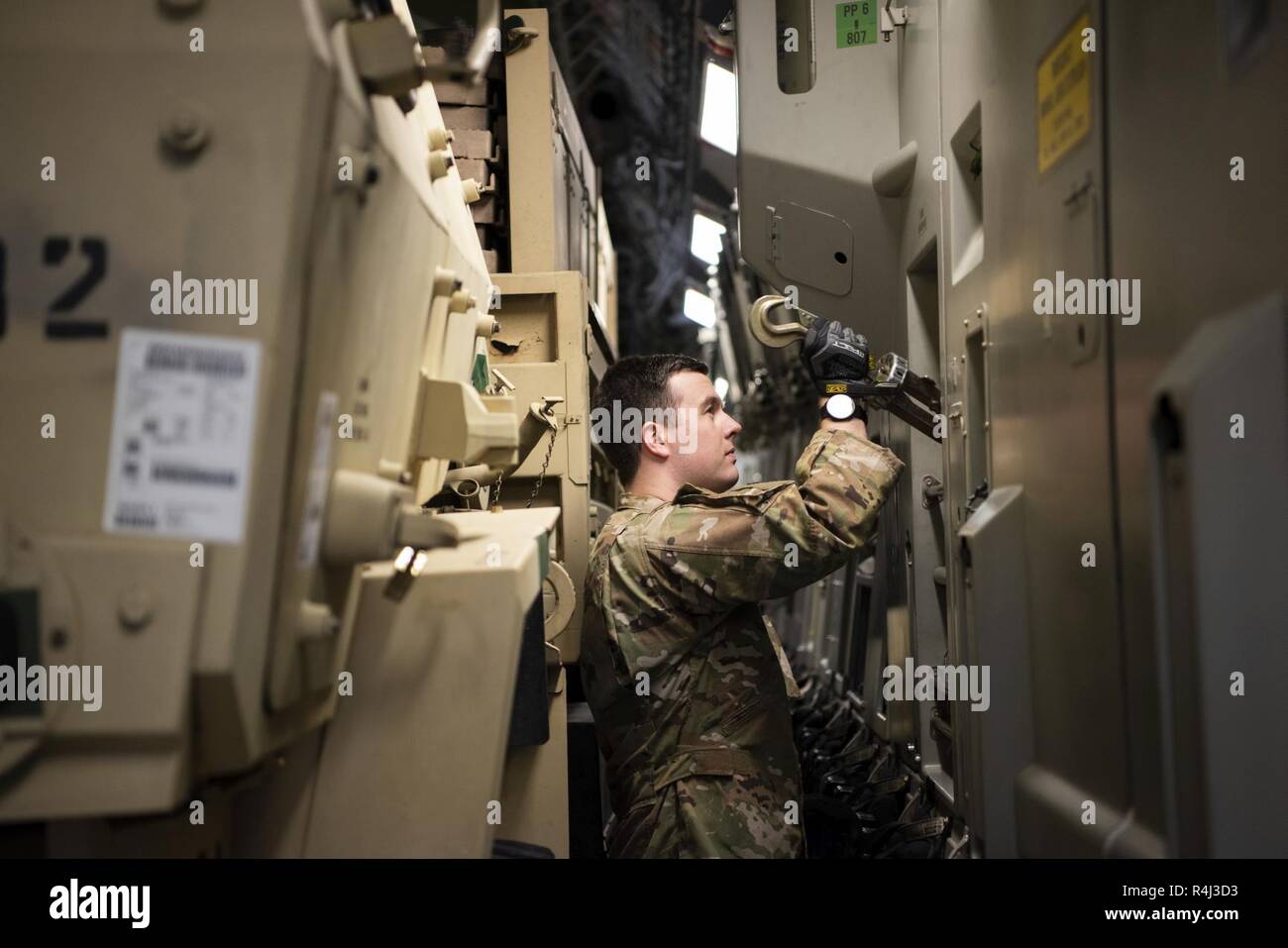 Airman 1st Class Trevor Pearce, loadmaster with the 3rd Airlift ...
