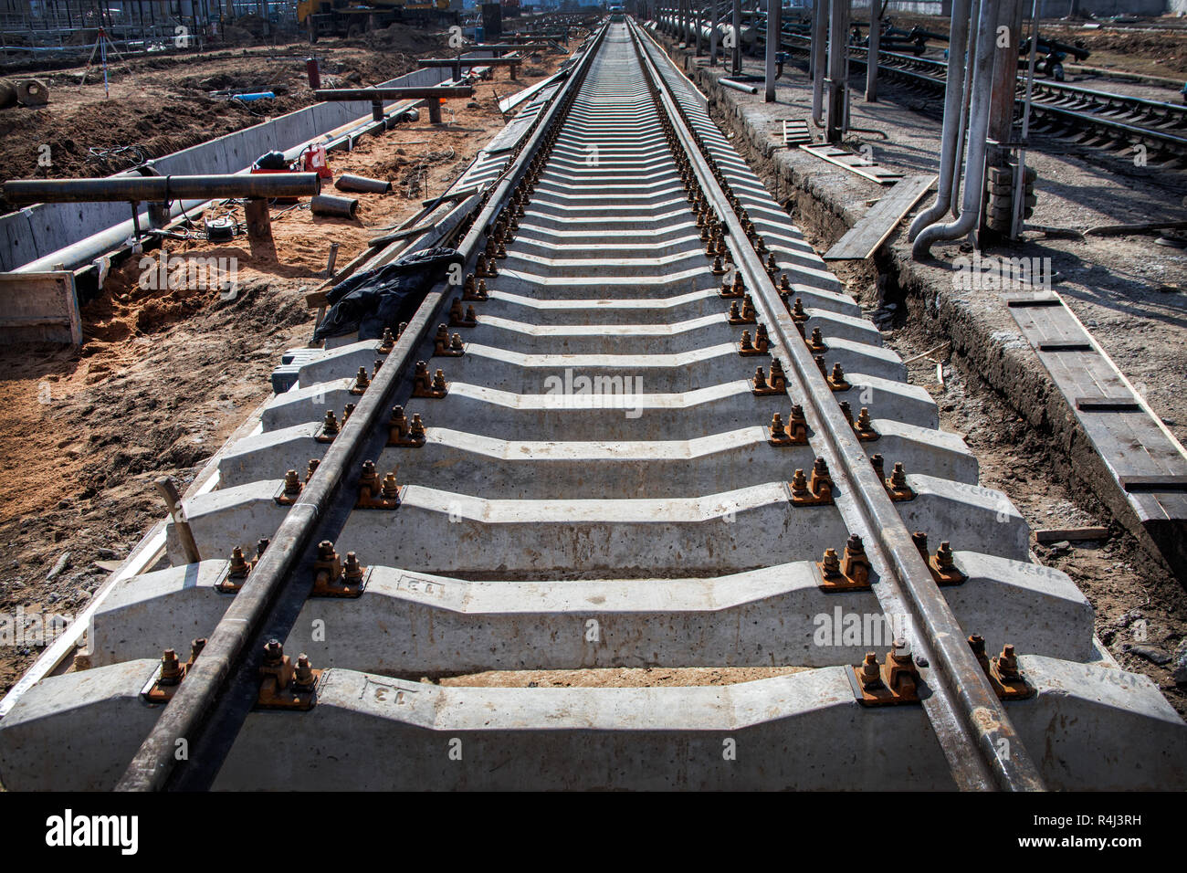 Perspective view of Concrete railroad ties in railway construction site ...