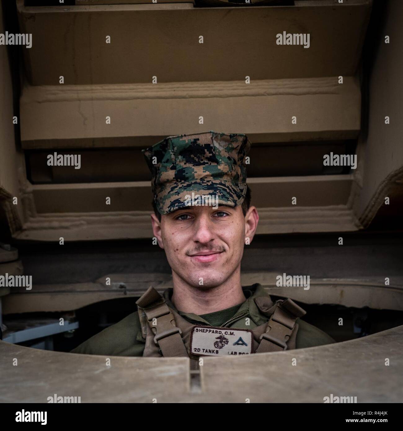 A Marine Lance Corporal sits inside his M1A1 Abrams tank at a media ...