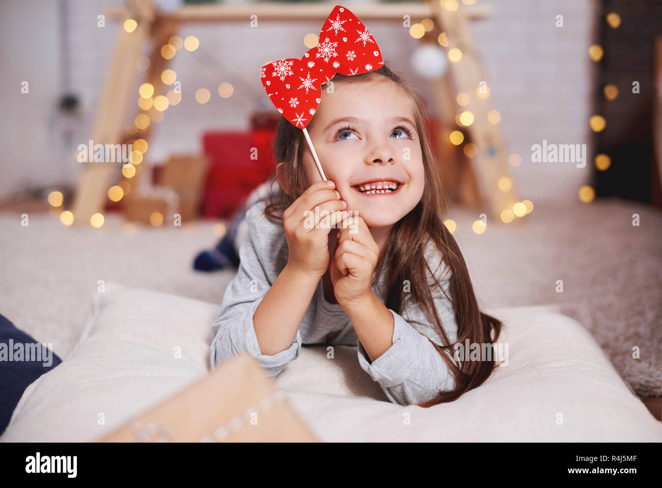 Portrait of cute girl looking up Stock Photo - Alamy