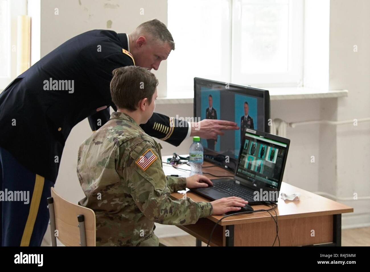 U.S. Army Spc. Emily Houdershieldt, right, assigned to Training Support ...