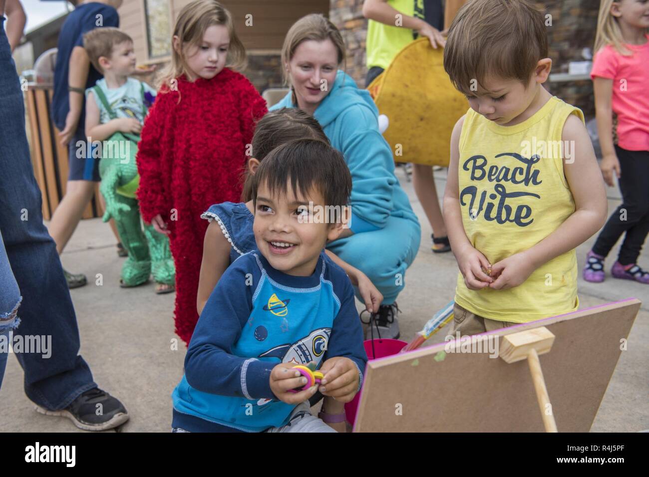 Logan Sadler, 4, smiles after winning a prize during a board game at ...