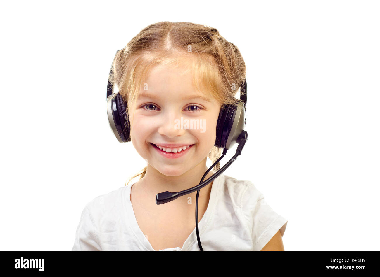 little girl with headset isolated on a white background Stock Photo - Alamy