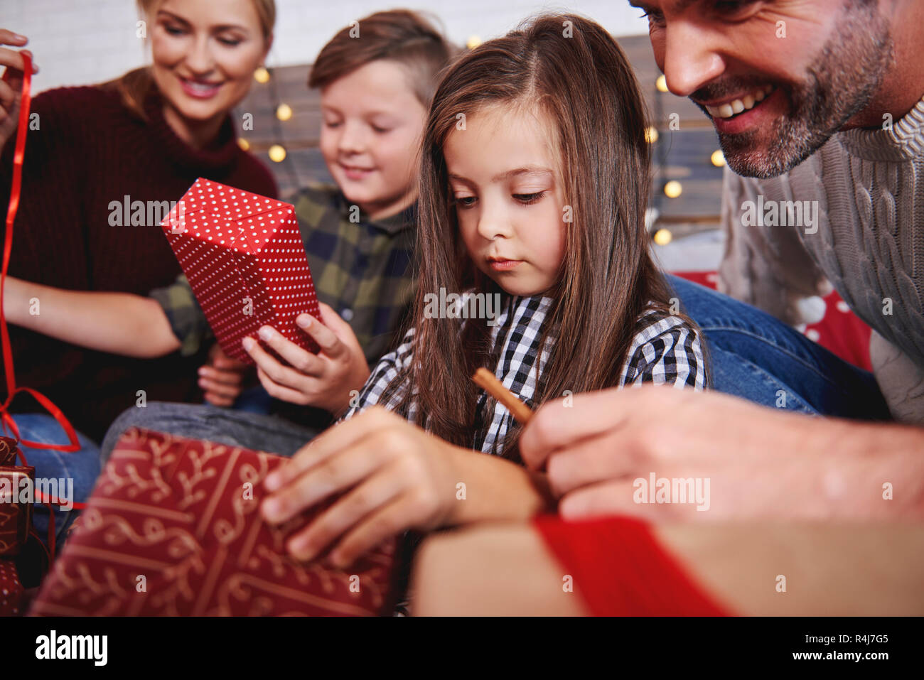 Family opening presents in hi-res stock photography and images - Alamy