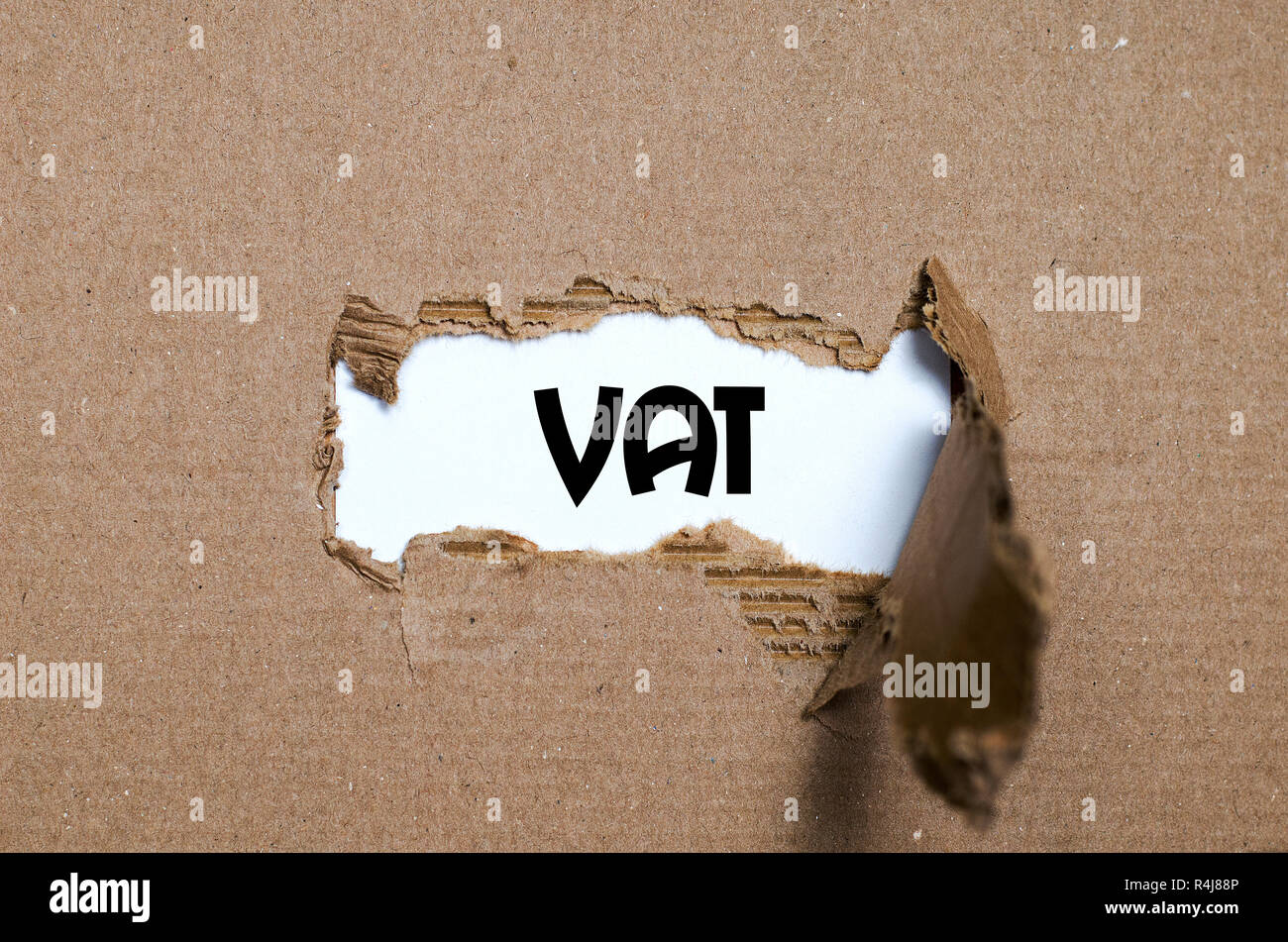 The word vat appearing behind torn paper Stock Photo - Alamy