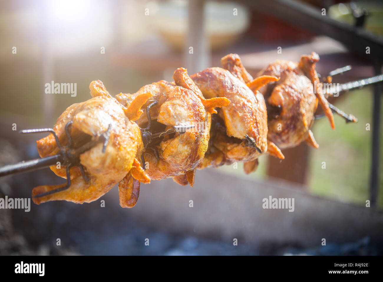 Grilled chicken on rotating machine Stock Photo - Alamy