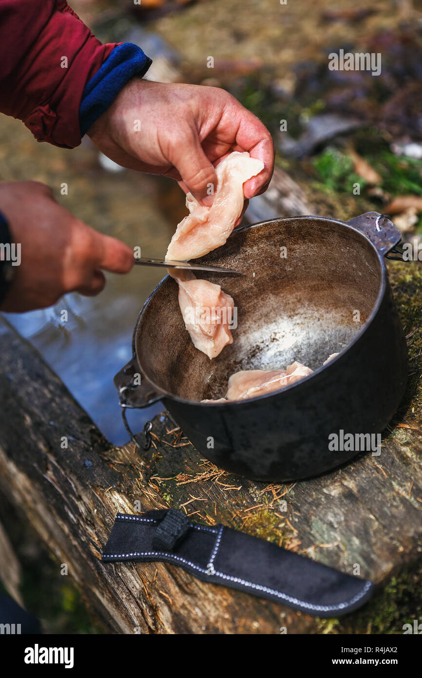 Outdoor cooking.Food in a cauldron on a fire Stock Photo - Alamy