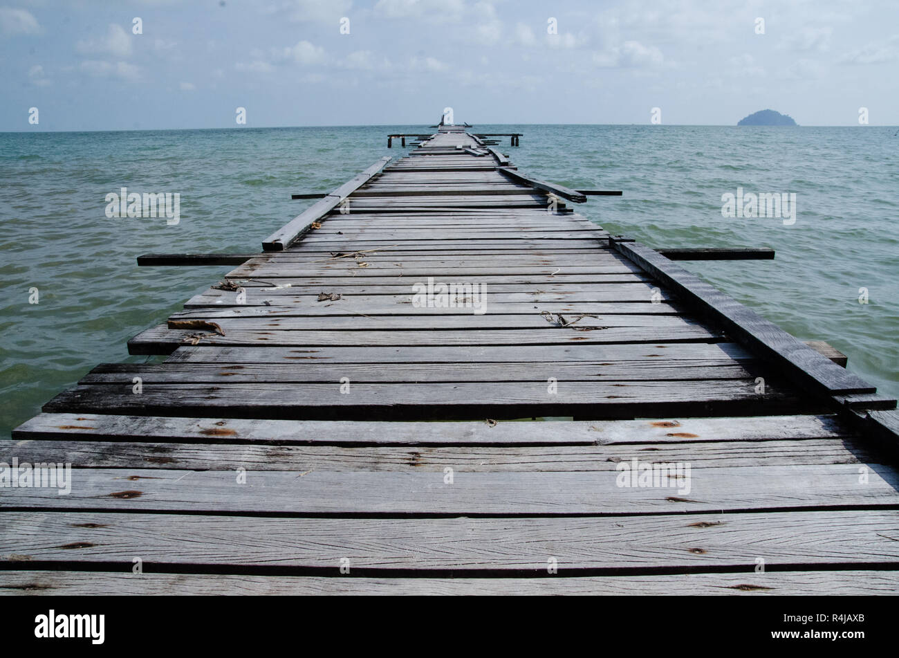 Wooden pier on the sea background Stock Photo - Alamy