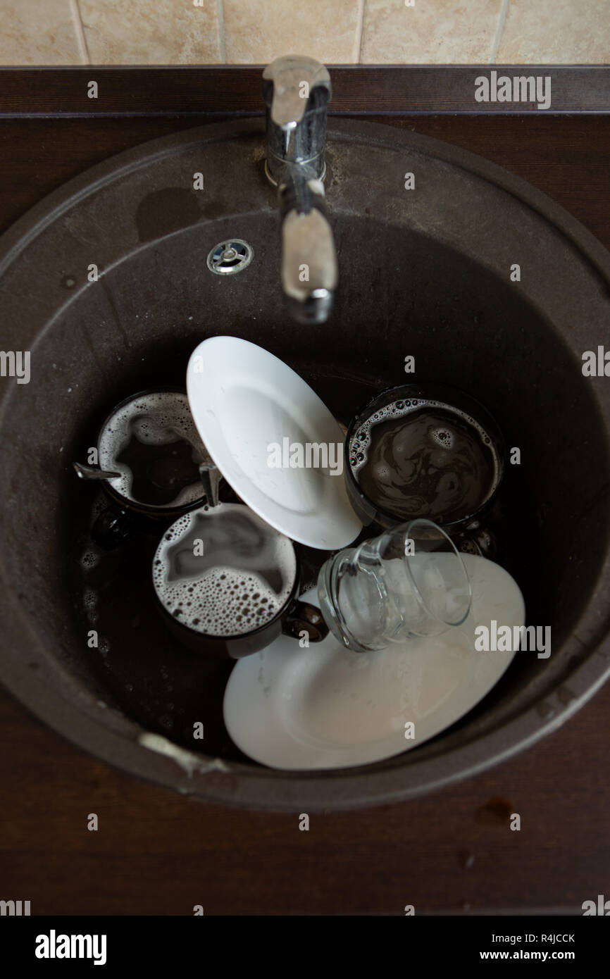 Dirty dishes in the kitchen sink Stock Photo - Alamy