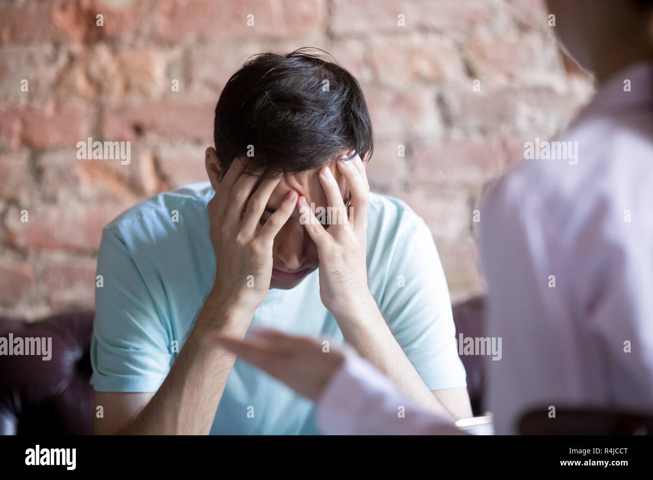 Frustrated man listening psychologist hi-res stock photography and ...