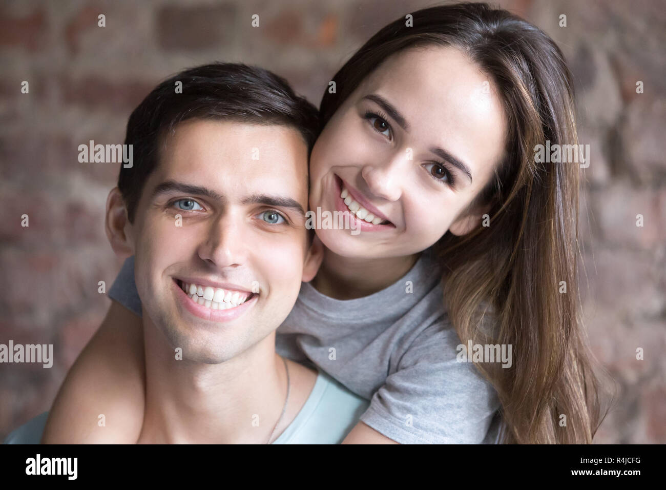 Attractive couple smiling hi-res stock photography and images - Alamy