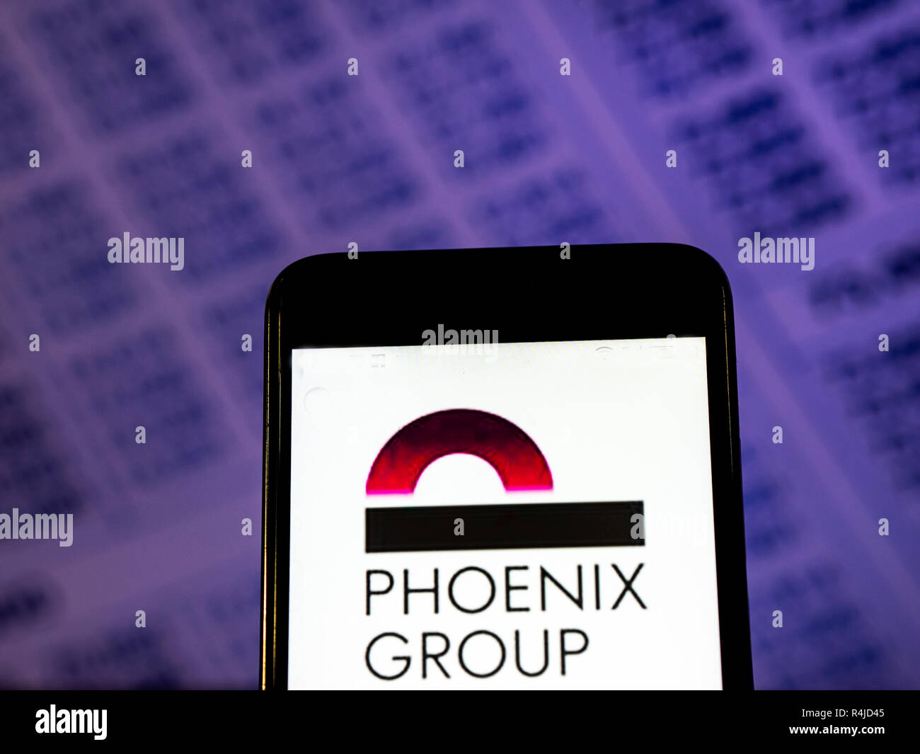Phoenix Group Insurance company logo seen displayed on smart phone ...