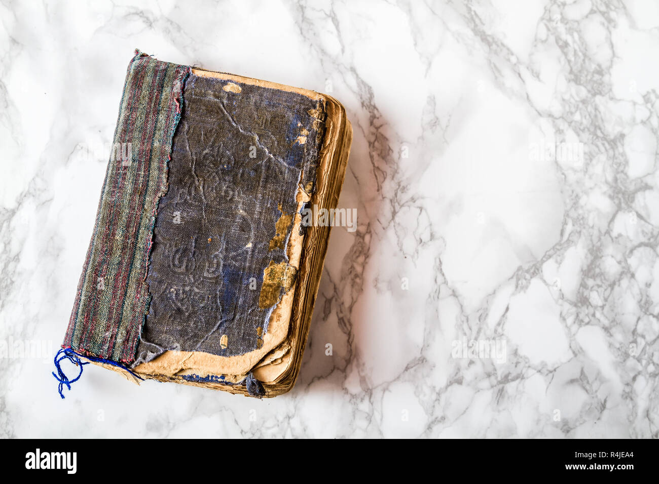 Antique weathered old book on marble background Stock Photo - Alamy
