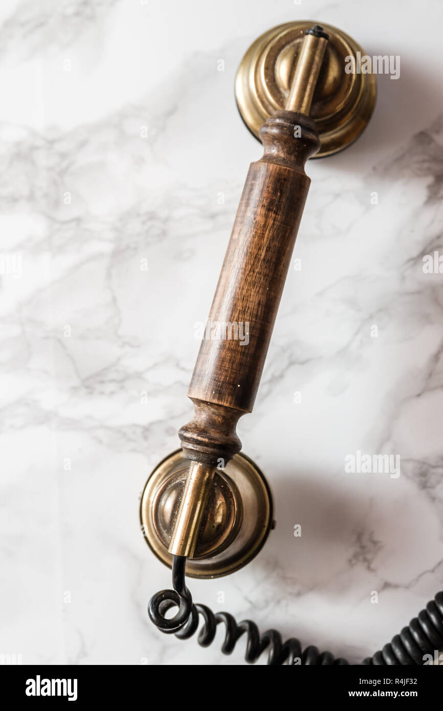 Antique magneto hand crank telephone set on marble background Stock ...