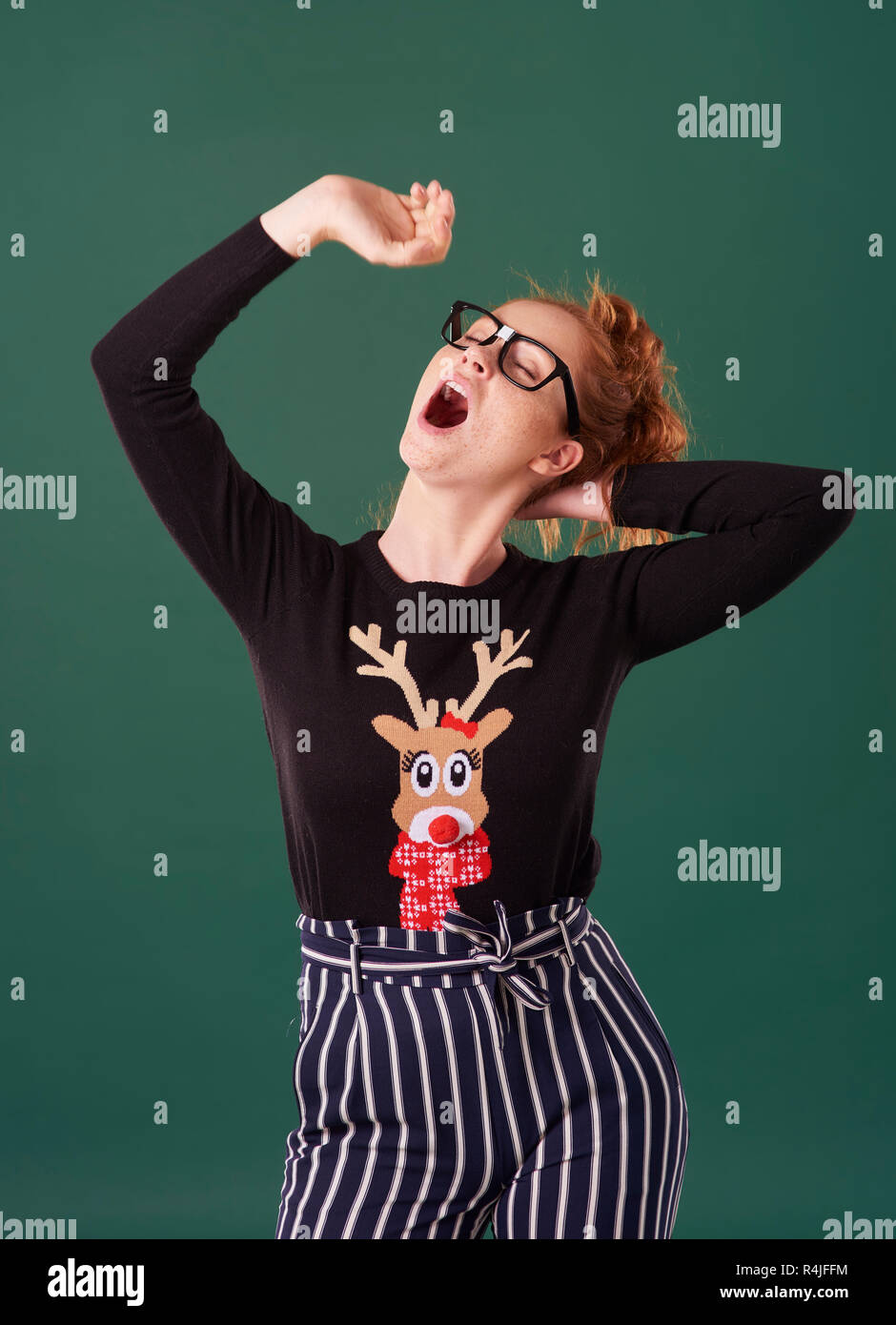Tired girl yawning and stretching Stock Photo - Alamy