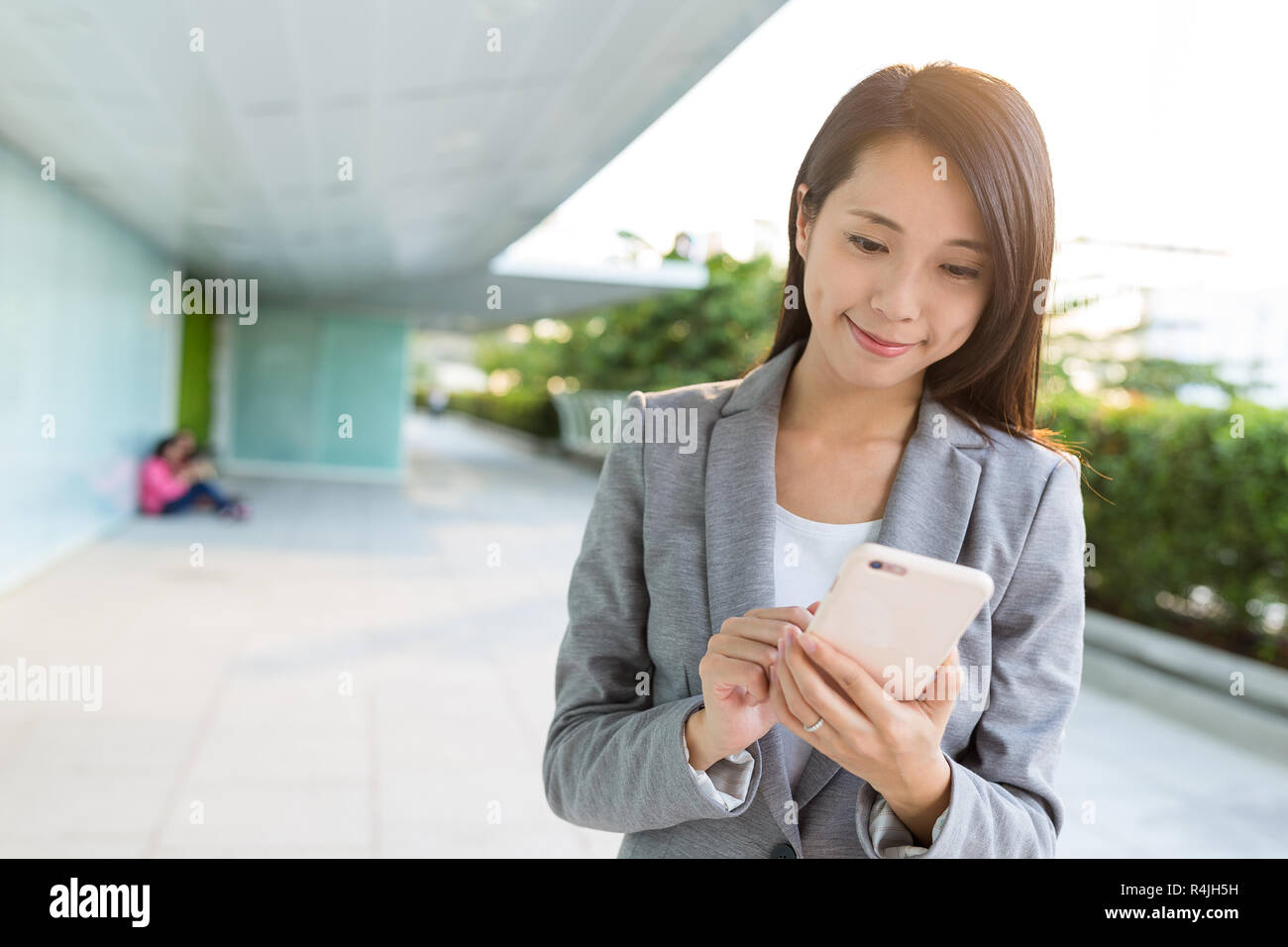 Asian girl using smartphone watching hi-res stock photography and ...
