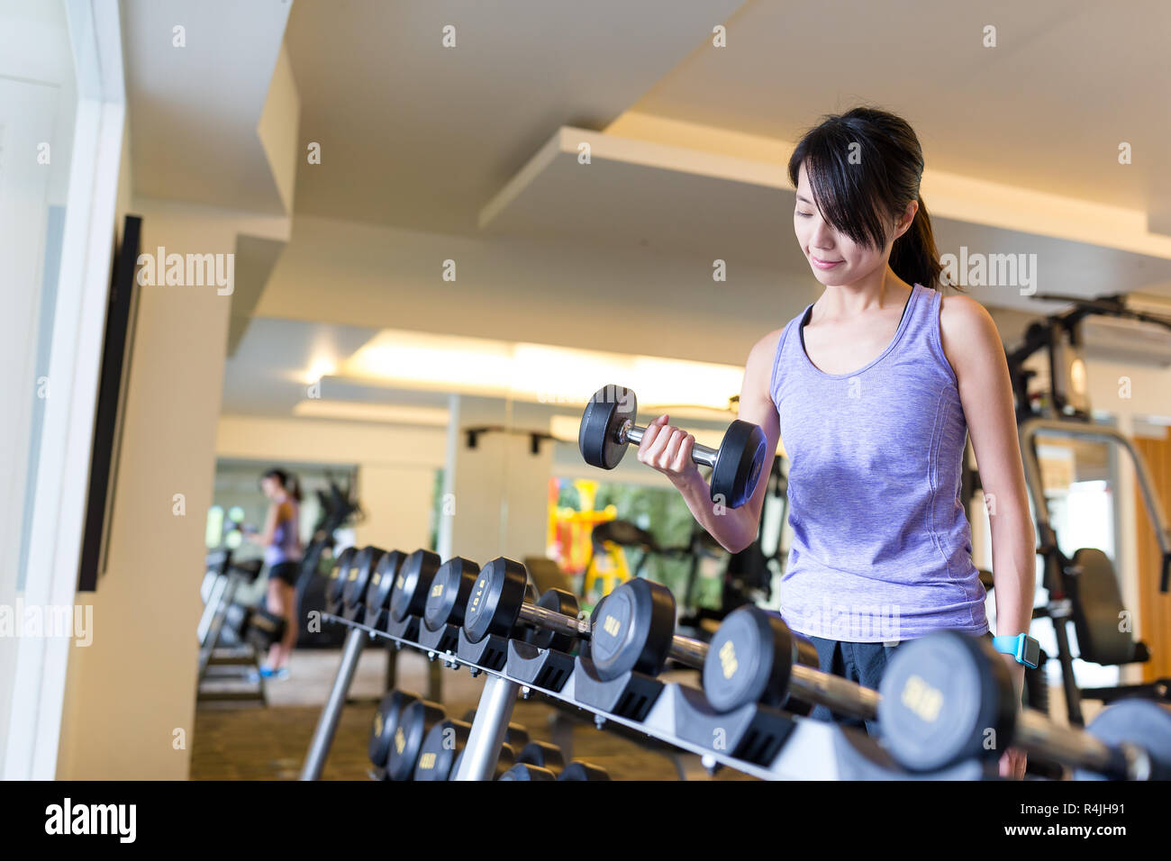 Woman workout with dumbbell Stock Photo - Alamy