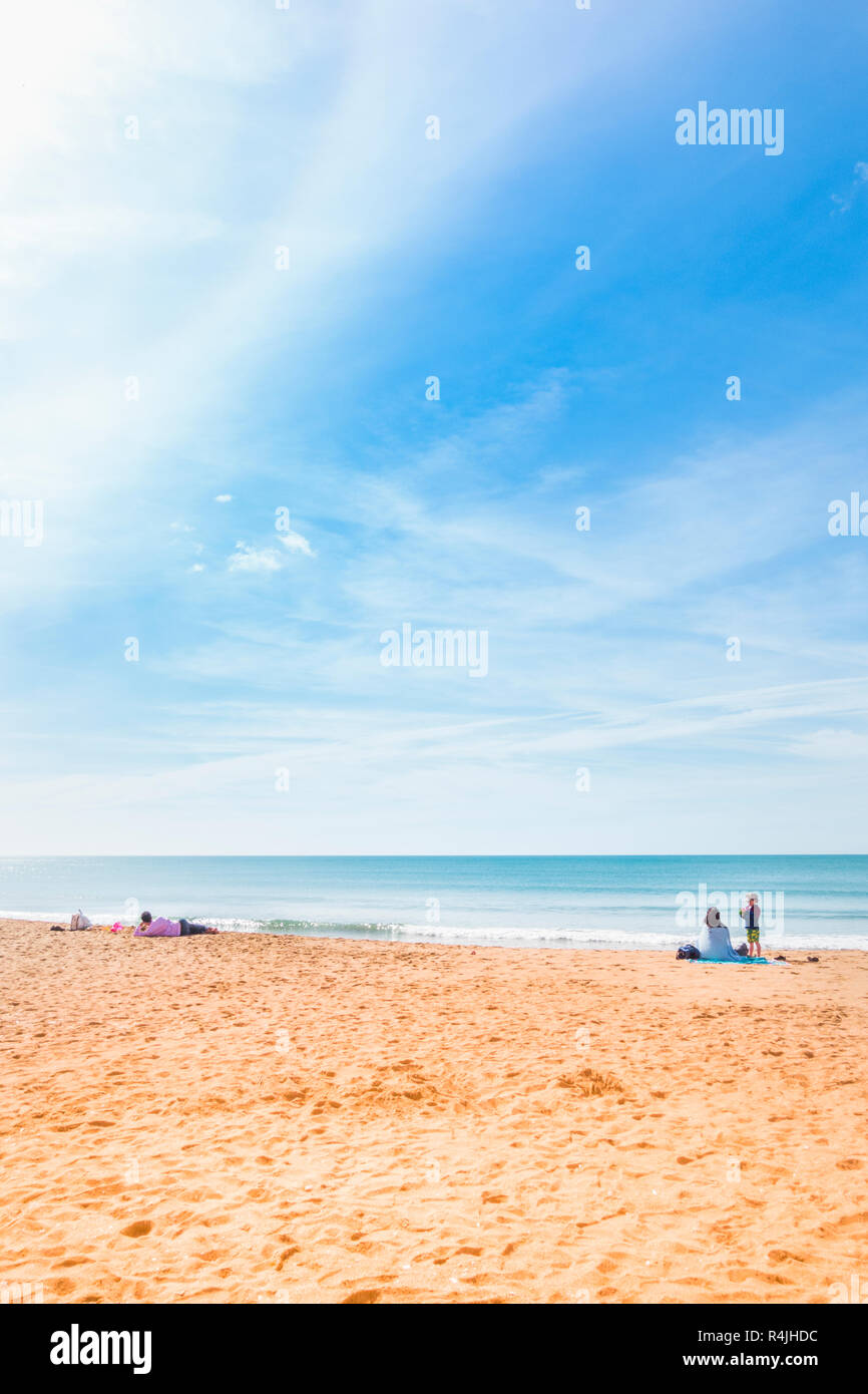 family on the beach in pre-season Stock Photo - Alamy