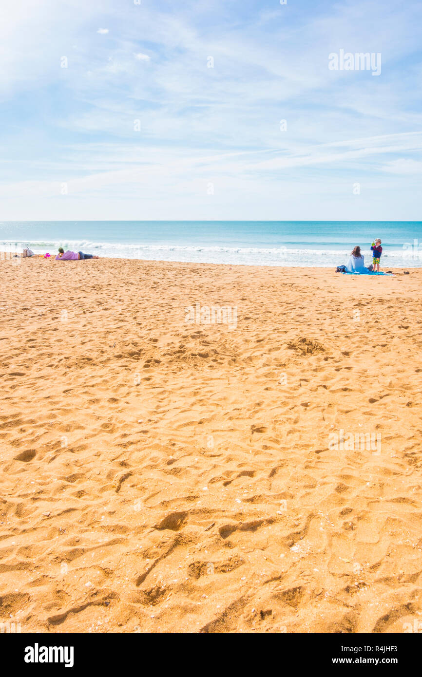 family on the beach in pre-season Stock Photo - Alamy