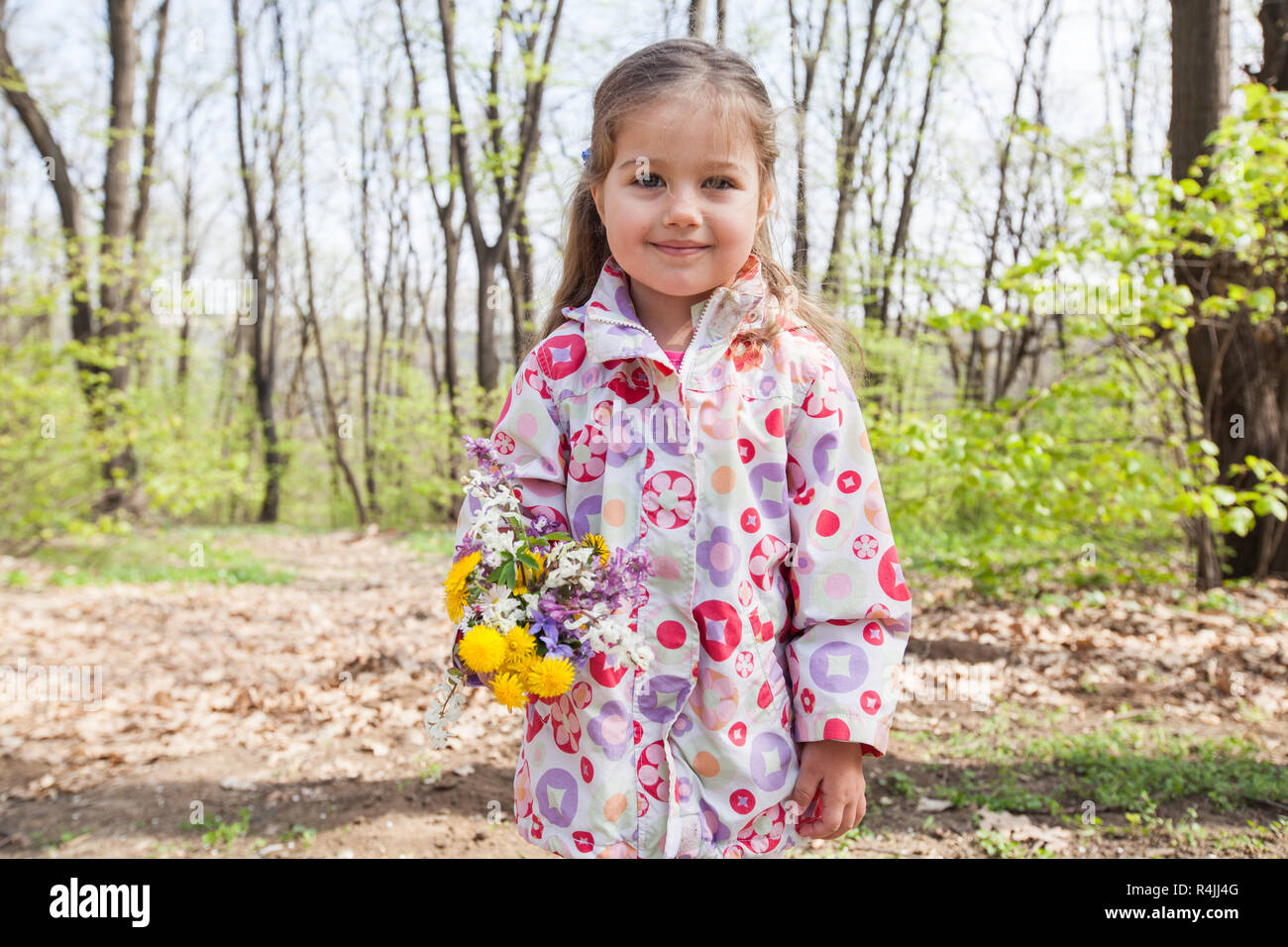 Spring Portrait of happy little girl Stock Photo - Alamy