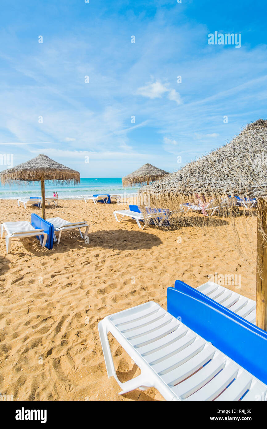 occasional tourists in pre-season at the beach Stock Photo - Alamy