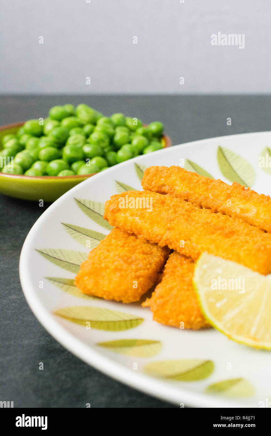Child eating fish fingers hi-res stock photography and images - Alamy