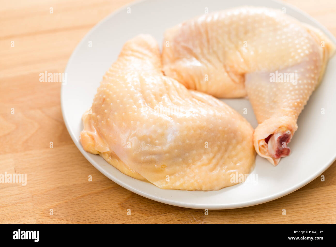 Raw chicken legs Stock Photo - Alamy