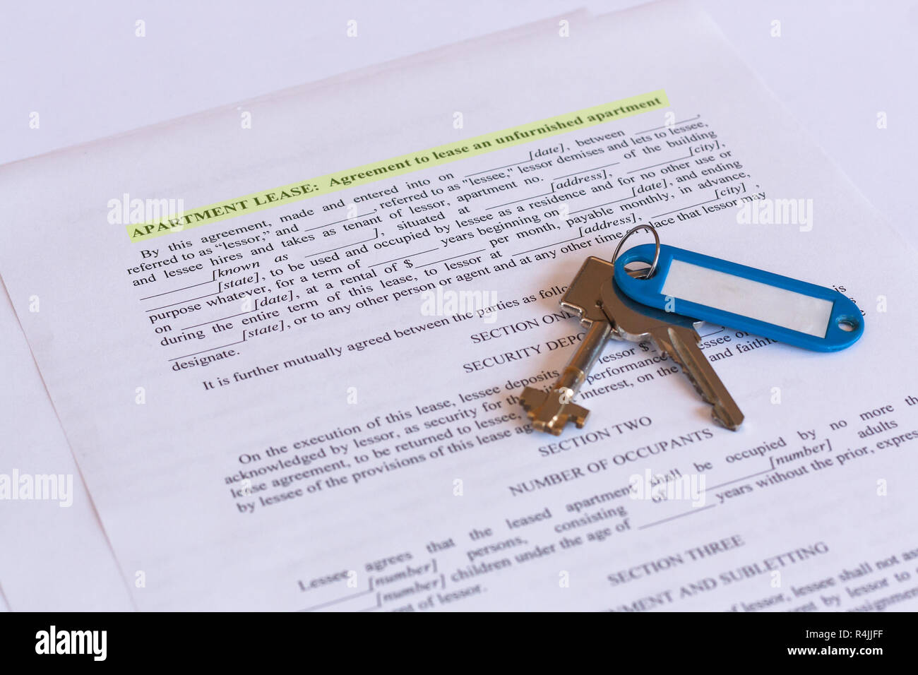 Lease / Rental agreement document in English with keys and pen ...