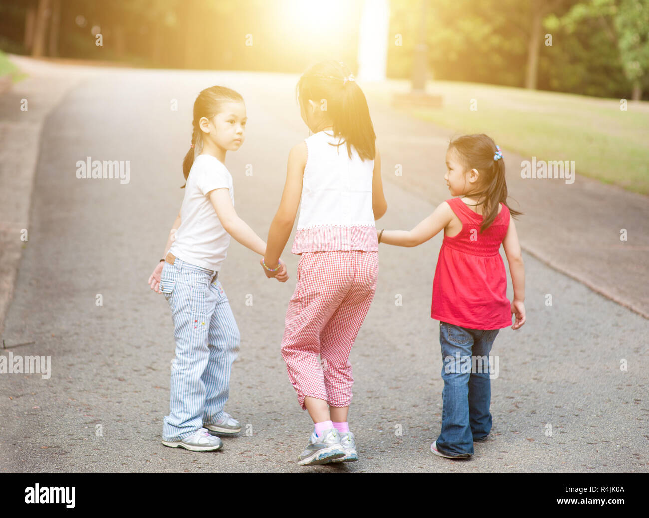 Asian children walking outdoor Stock Photo - Alamy