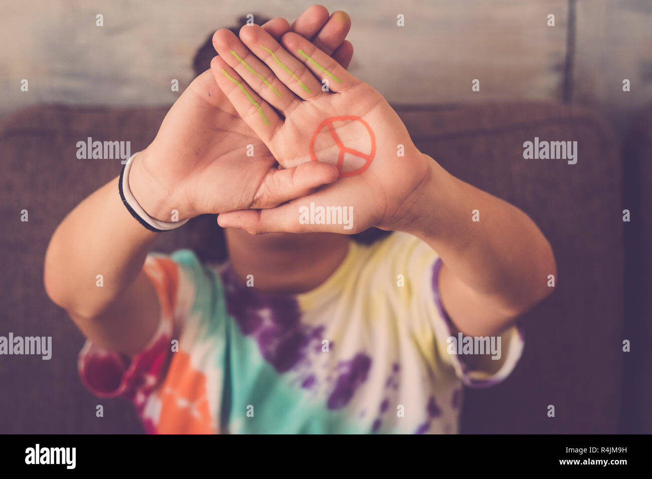 peace no war symbol painted on hand of young boy - message for the ...