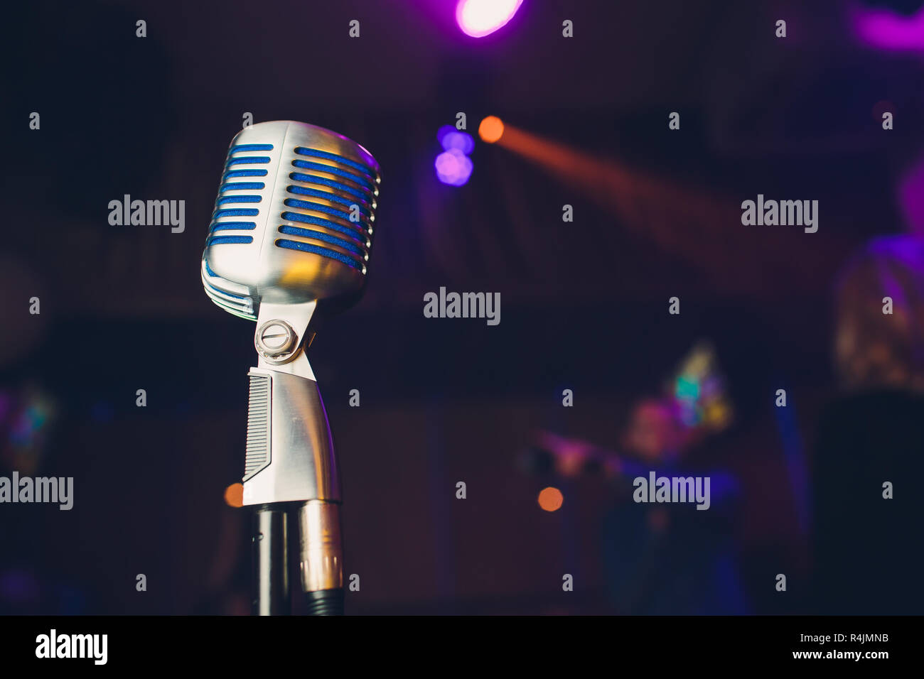 Retro microphone on stage in a pub or American Bar restaurant during a ...