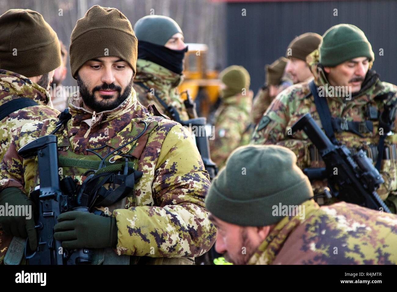 Members of the Italian military prepare to begin a multinational cold ...