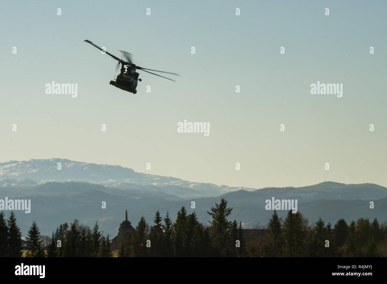 A Danish AW101-Merlin helicopter flies overt Camp Fremo during Exercise ...