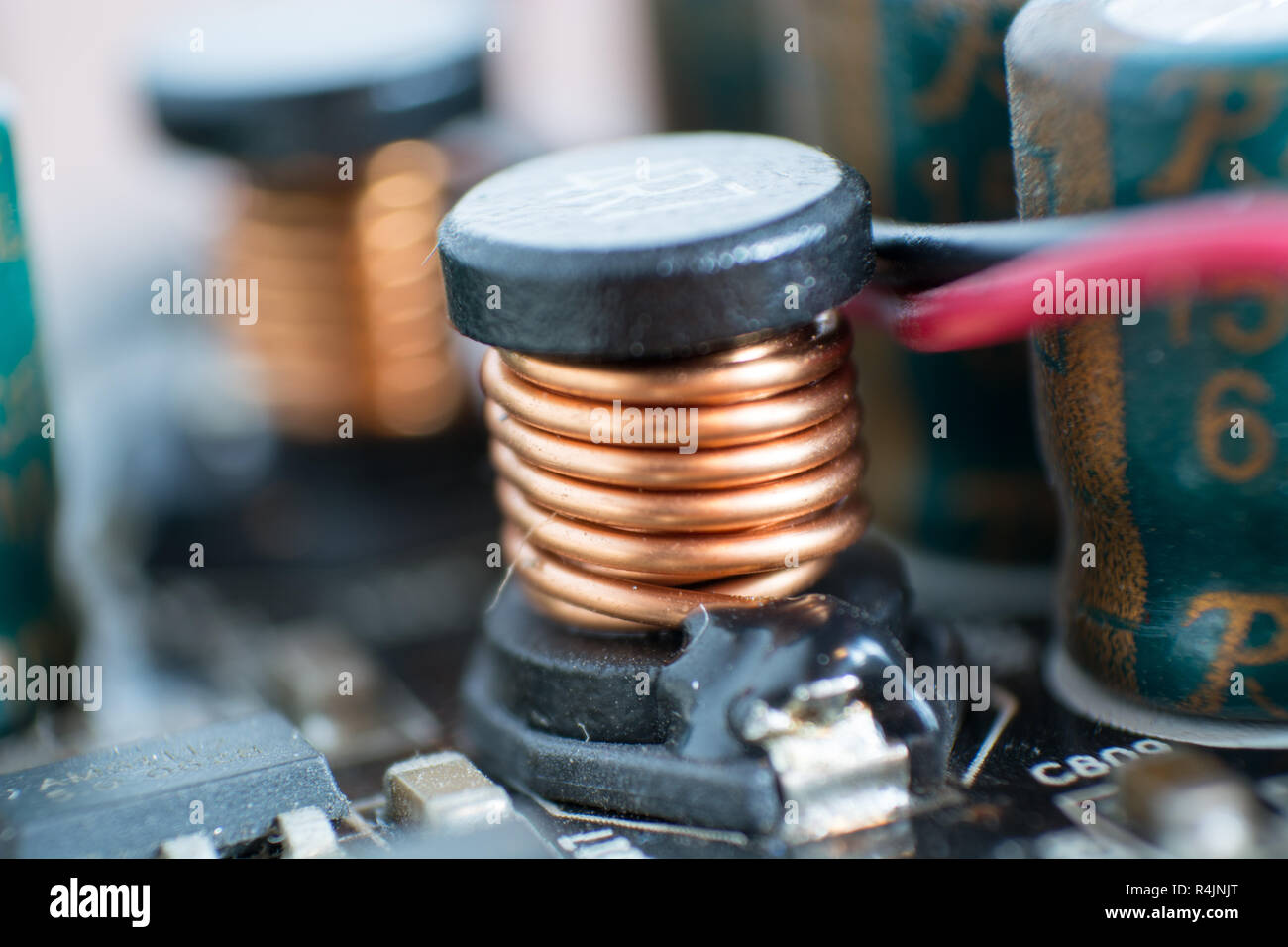 Electrolytic capacitor and conductor visible on the printed circuit ...
