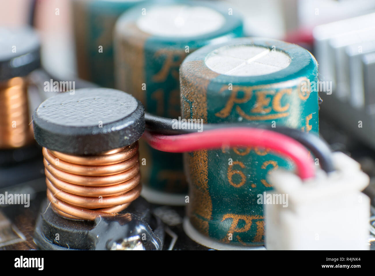 Electrolytic capacitor and conductor visible on the printed circuit ...