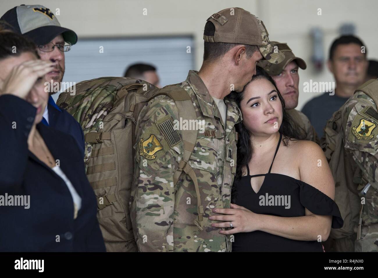 Capt. Justin Wilson 823d Base Defense Squadron (BDS), embraces a loved ...