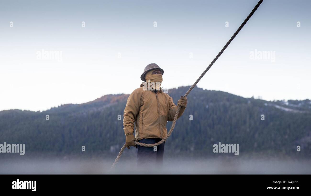 A U.S. Marine assigned to 2nd Marine Aircraft Wing offloads equipment ...