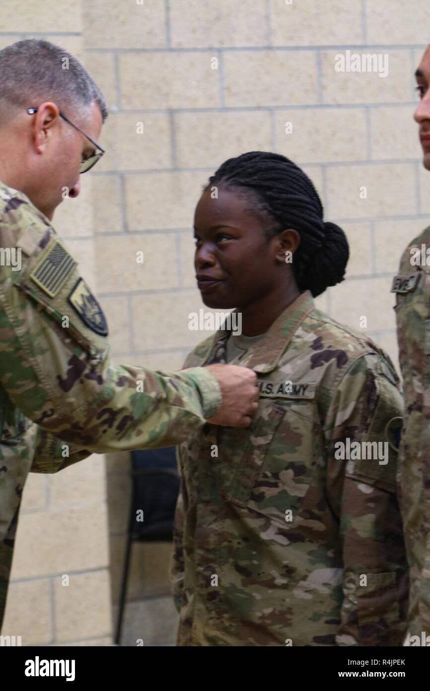 Spc. Erica Taylor receives the Army Achievement Medal from Brig. Gen ...