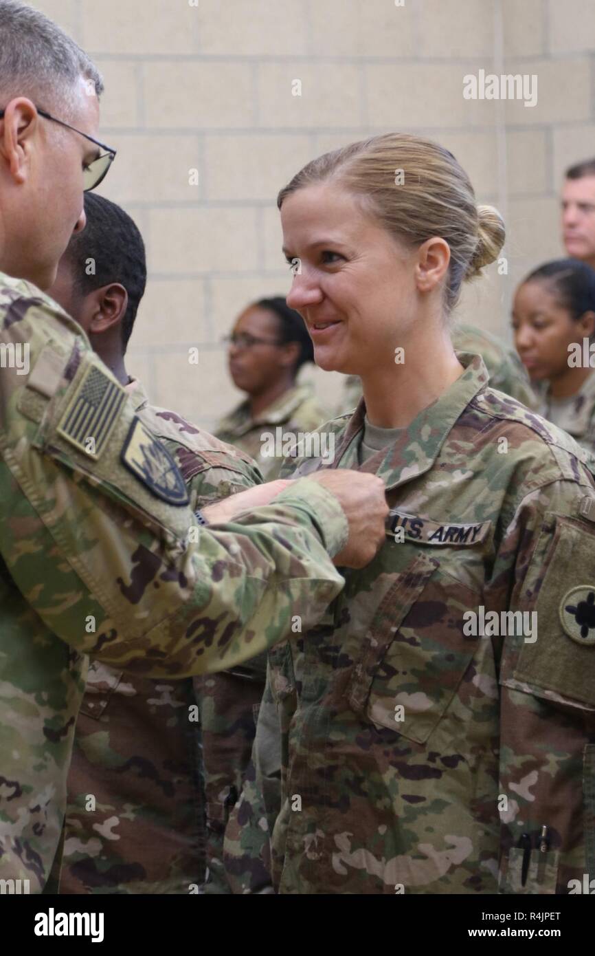 Sgt. Brittany Frazier receives the Army Achievement Medal from Brig ...