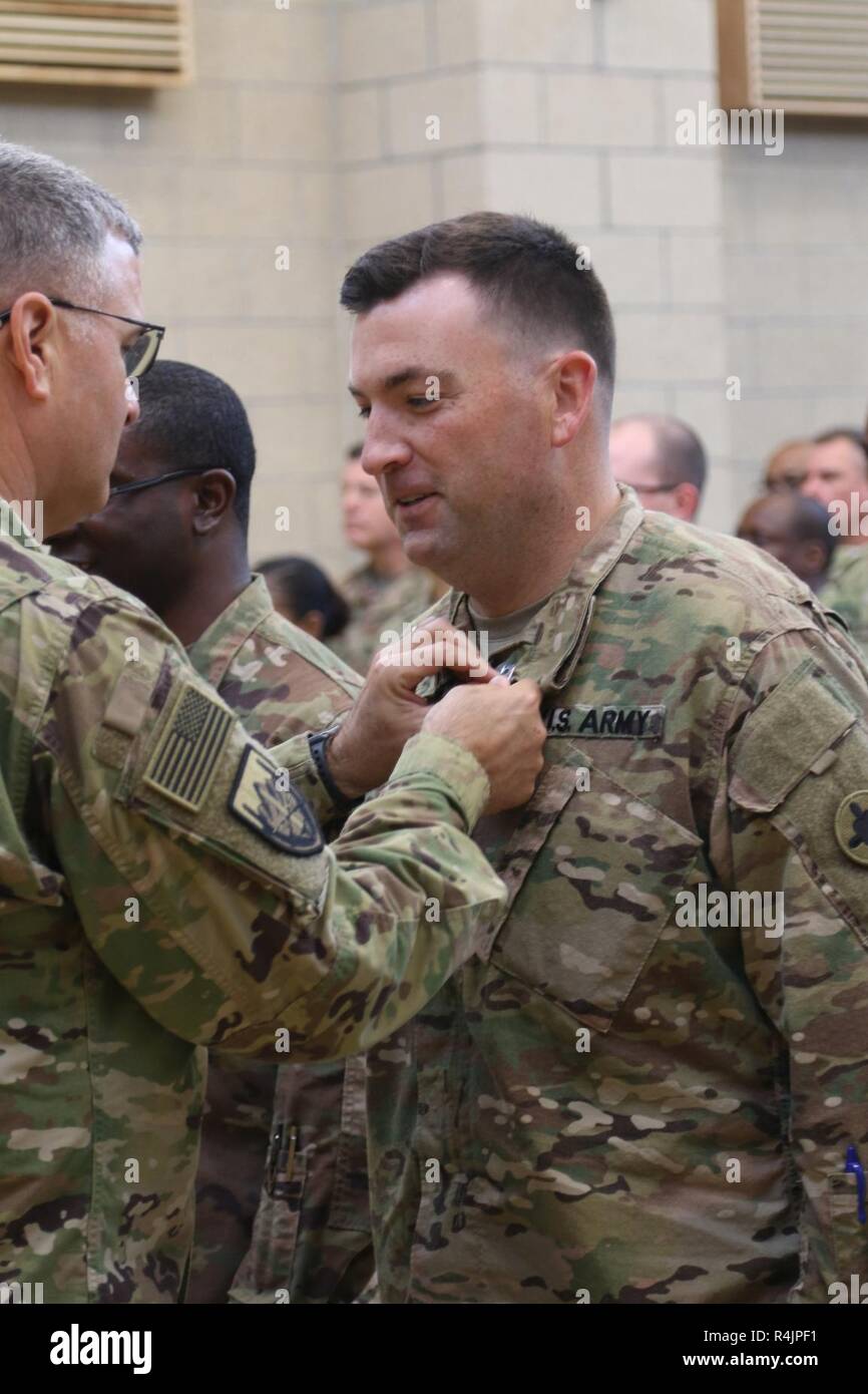Cpt. Jason Little Jr. receives the Army Achievement Medal from Brig ...