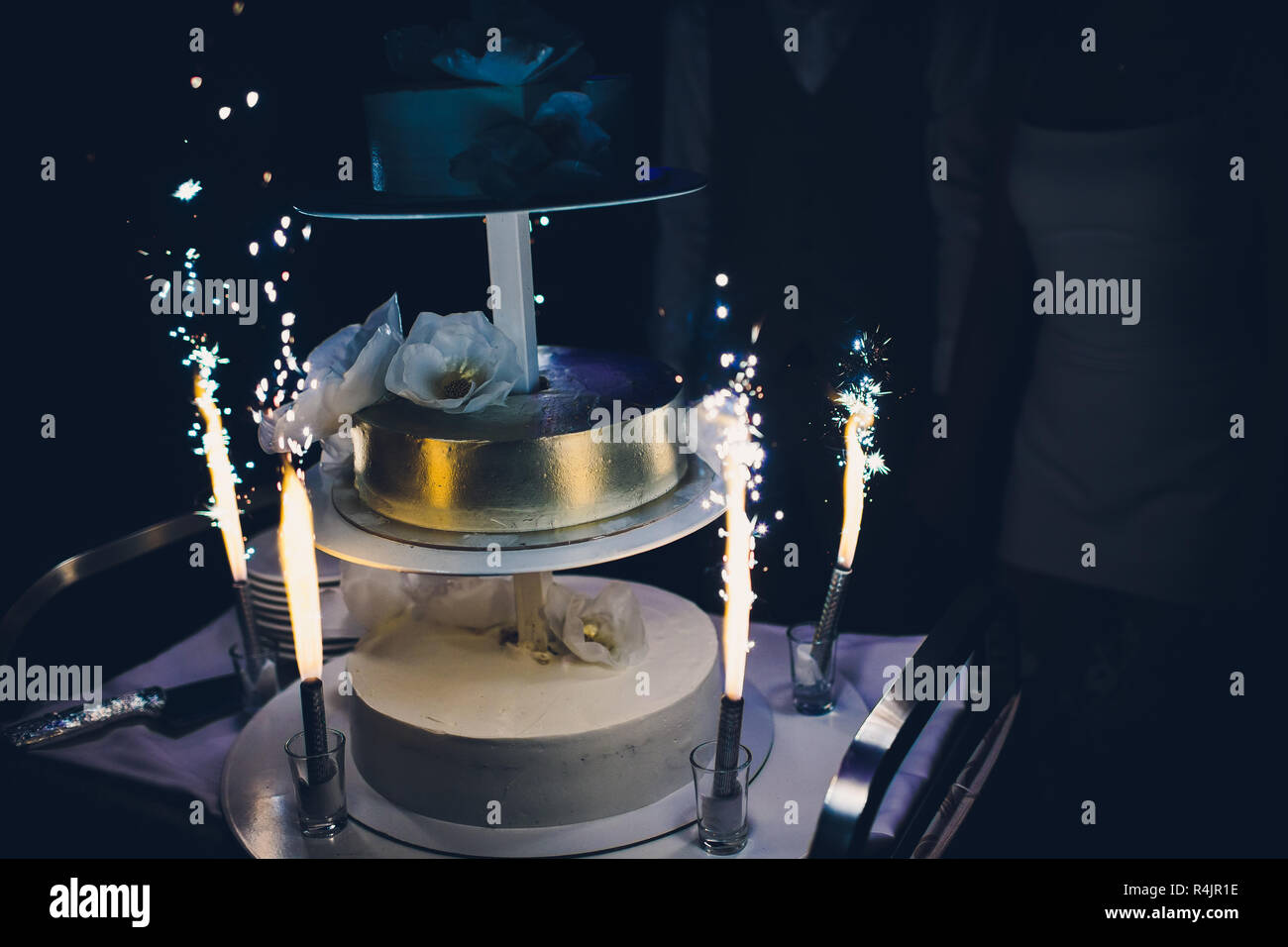 The wedding cake with fireworks stand on the table in restaurant Stock ...