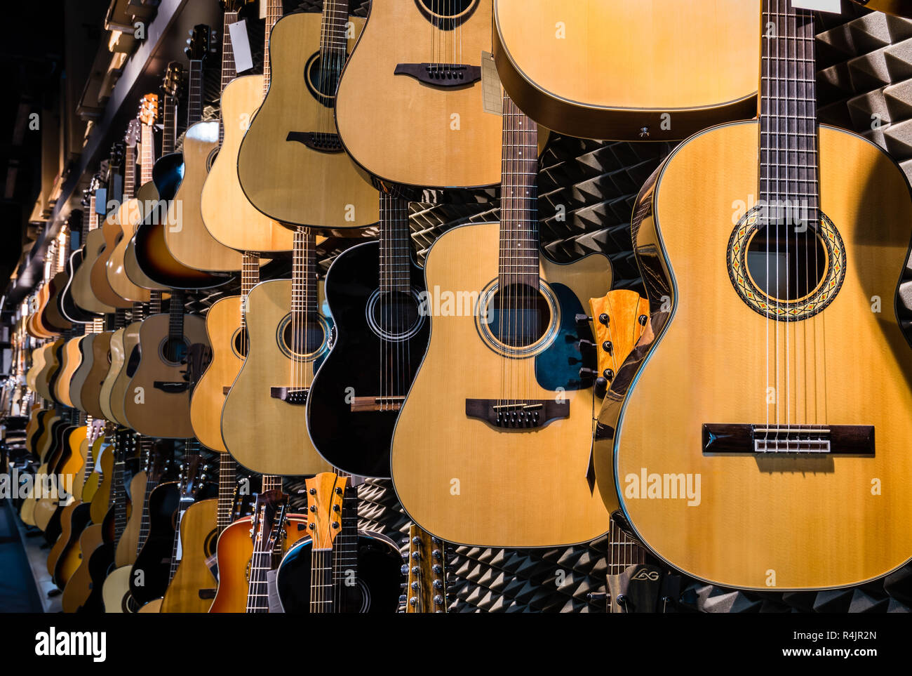 Guitars in Shop Stock Photo - Alamy