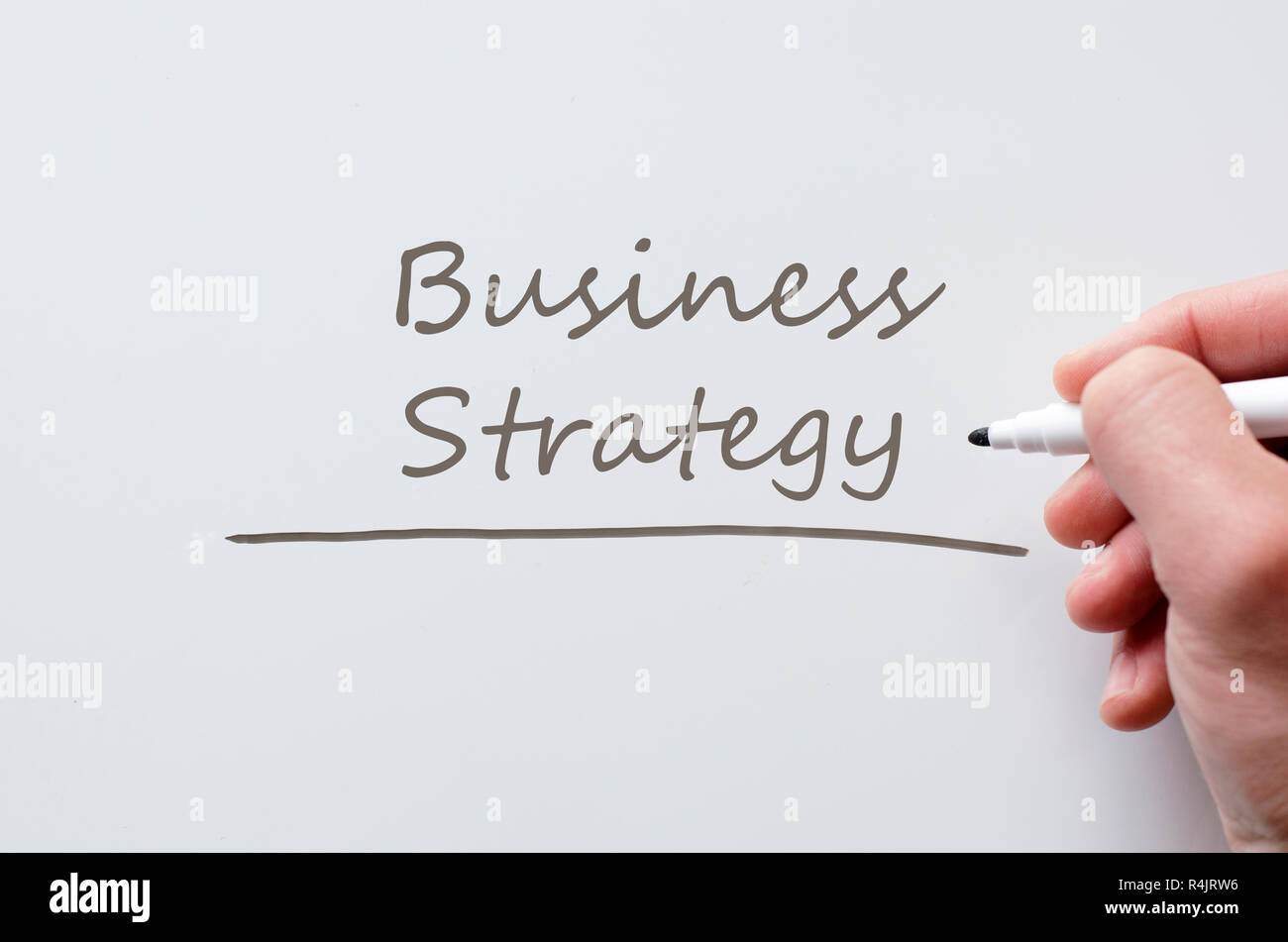 Business strategy written on whiteboard Stock Photo - Alamy