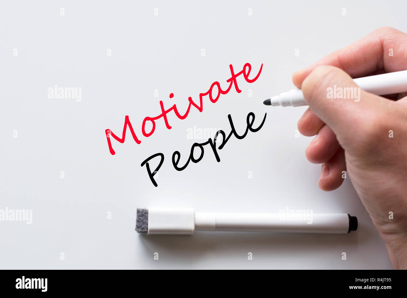 Motivate people written on whiteboard Stock Photo - Alamy