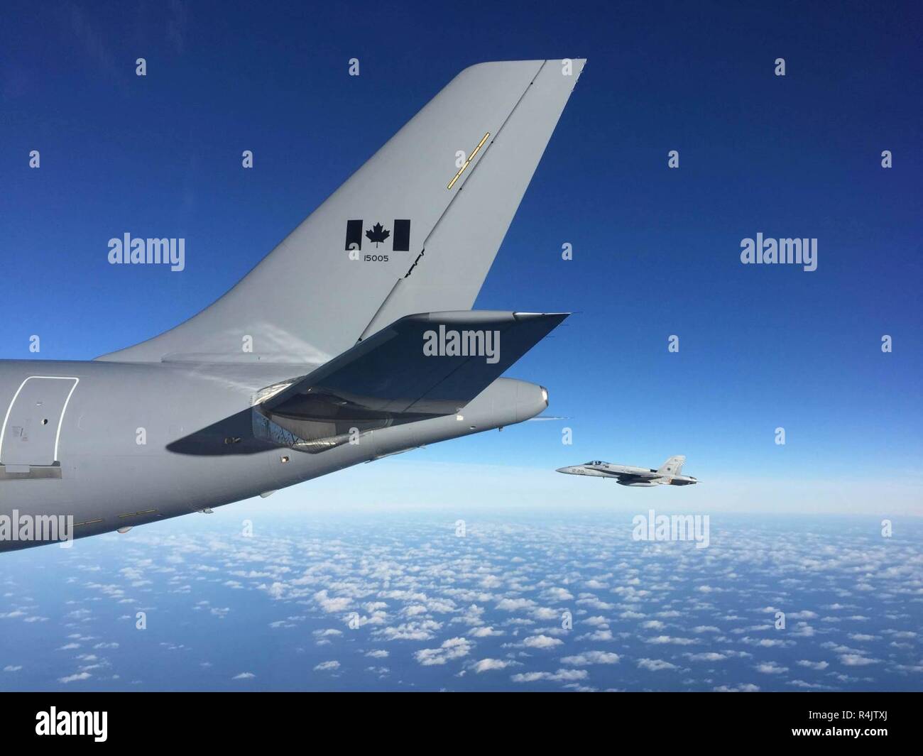 A Spanish F-18 getting ready for tanking by a Canadian tanker CC-150 ...