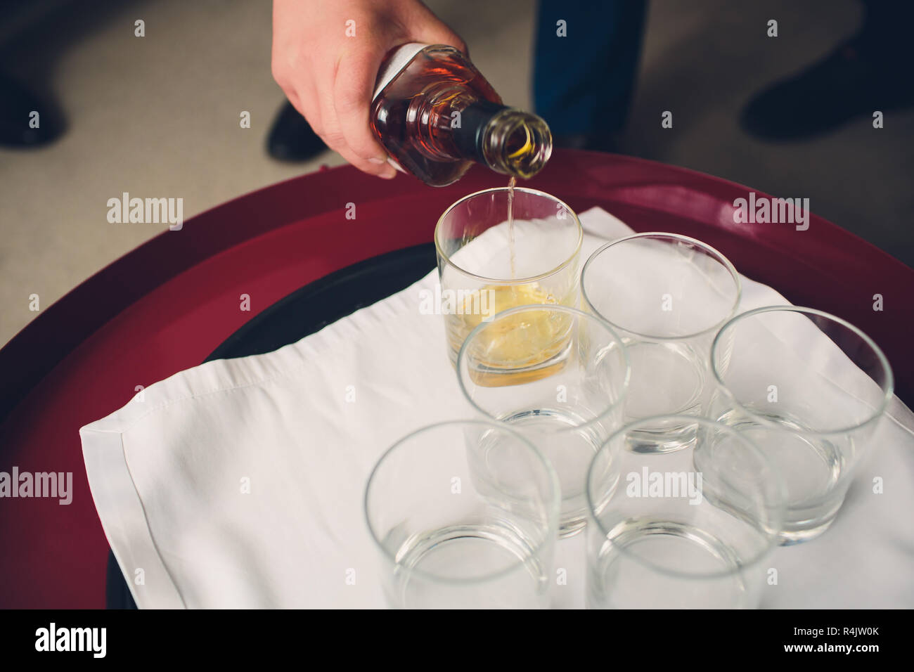 barman pouring alcoholic digestif in glasses at bar Stock Photo - Alamy
