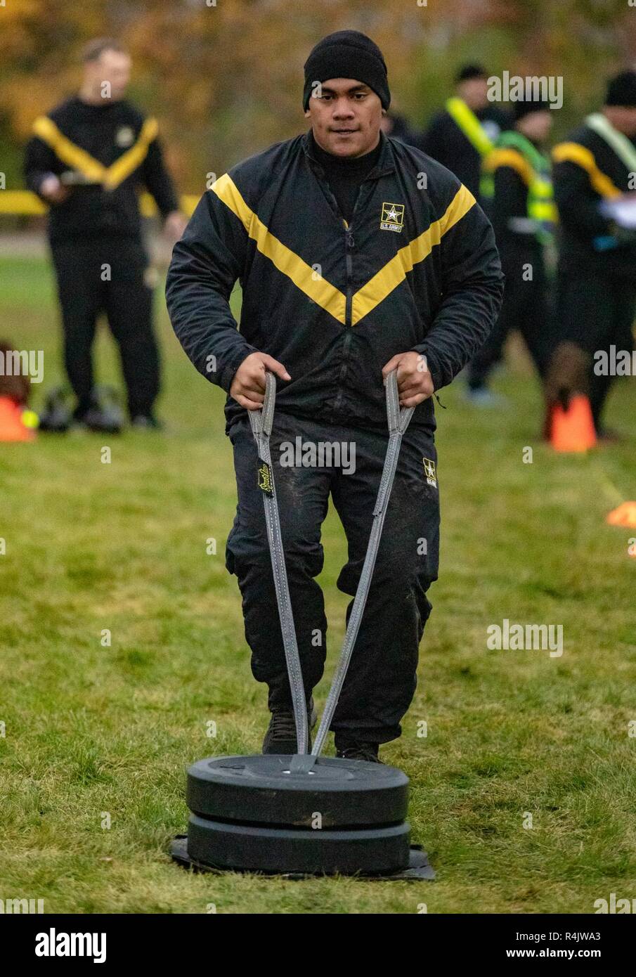Sgt. Kevin Luafulu, 1-32IN, 1BCT10MTN, drags a 90 pound sled during the ...