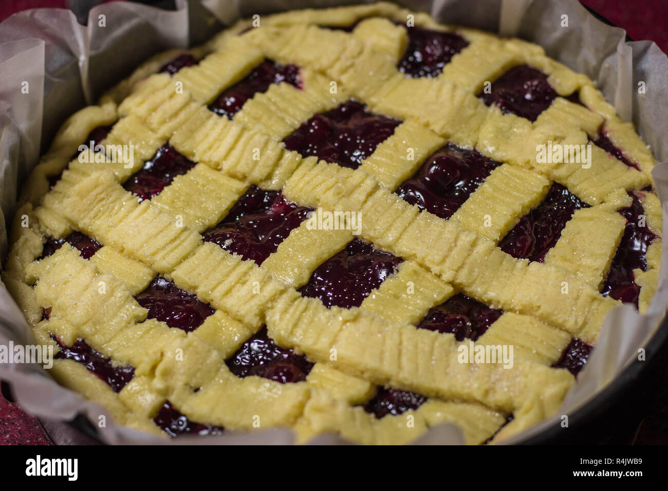Unbaked american pie with cherry Stock Photo - Alamy
