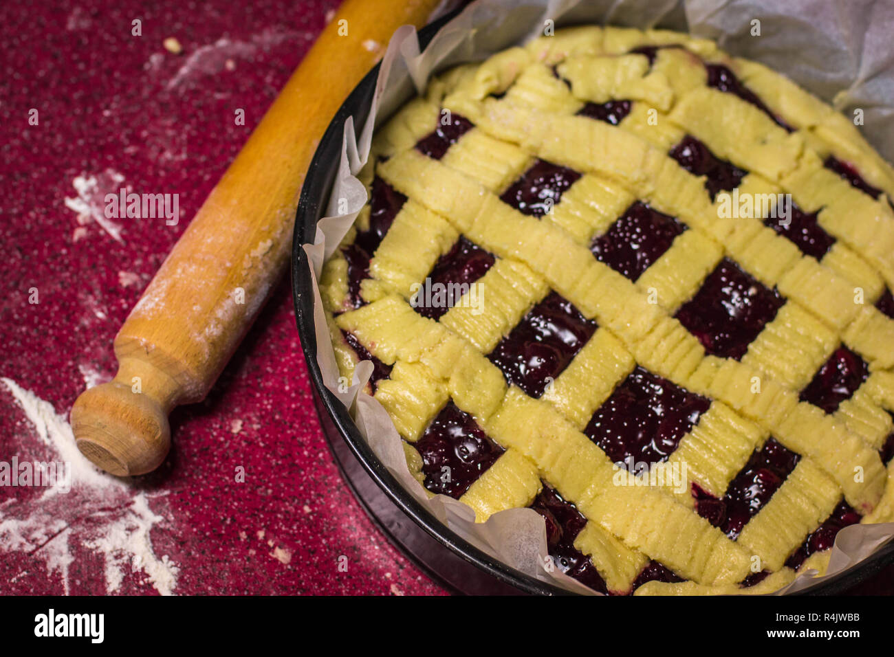 Unbaked american pie with cherry Stock Photo - Alamy
